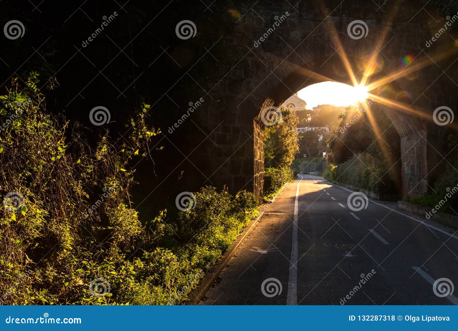 Sunlit Arch Over a Bicycle Path Stock Photo - Image of castle, nature ...