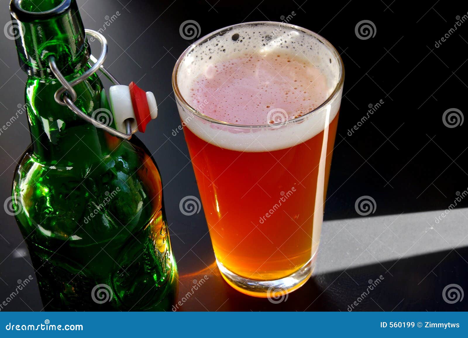 Sunlit beer stock image. Image of brew, malt, bottle, head - 560199