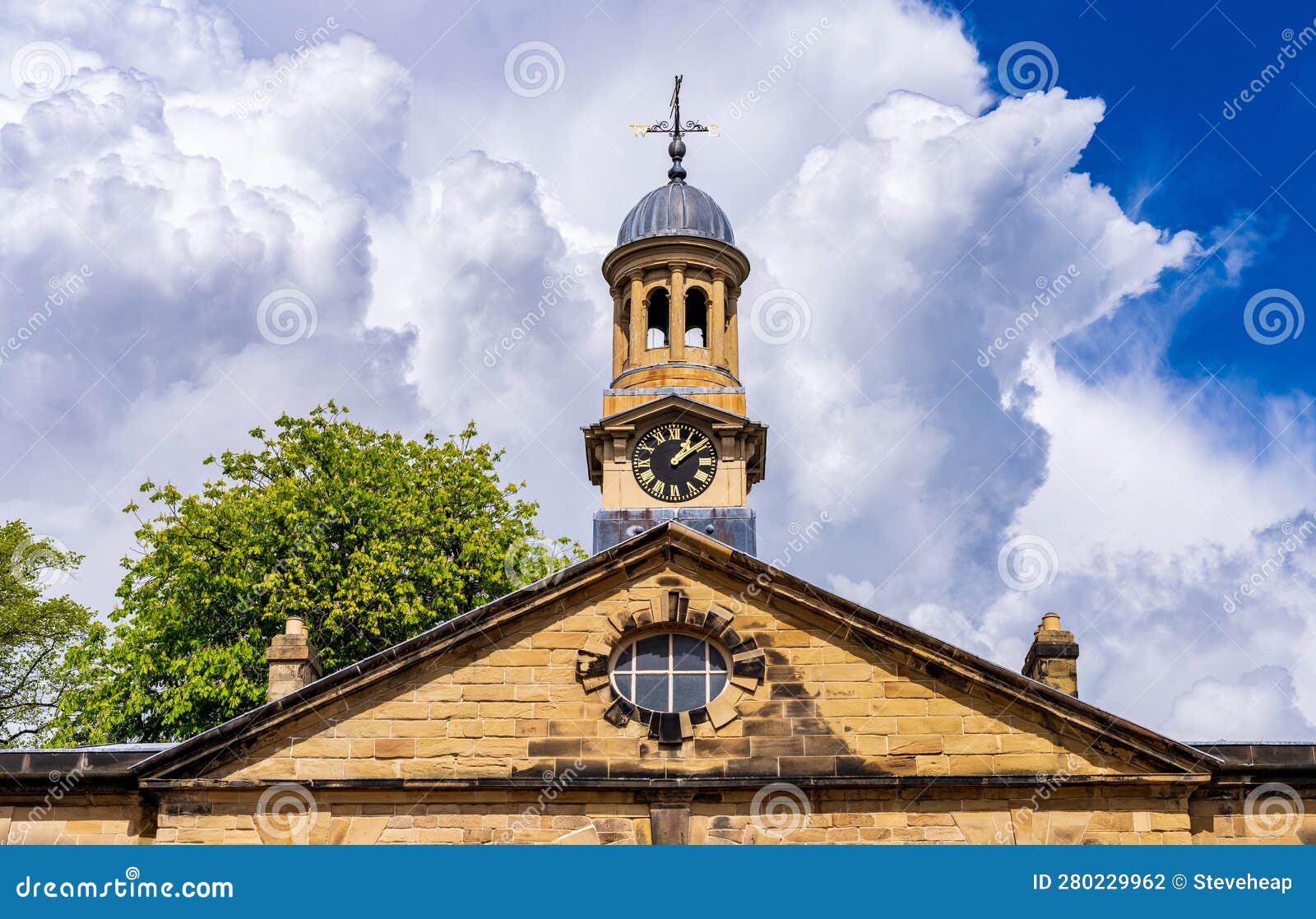 Sunlit Clock Tower of Stone Stable Block with Dramatic Sky Stock Photo ...