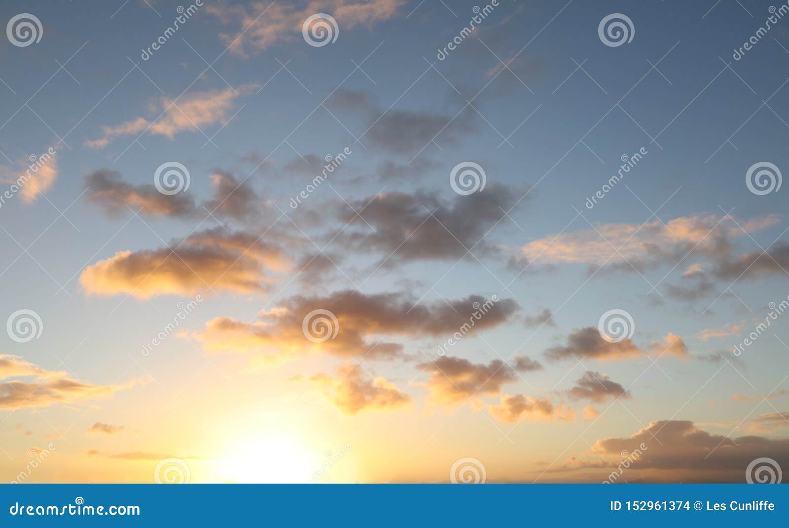 Sunlit clouds in sky stock photo. Image of dawn, summer - 152961374