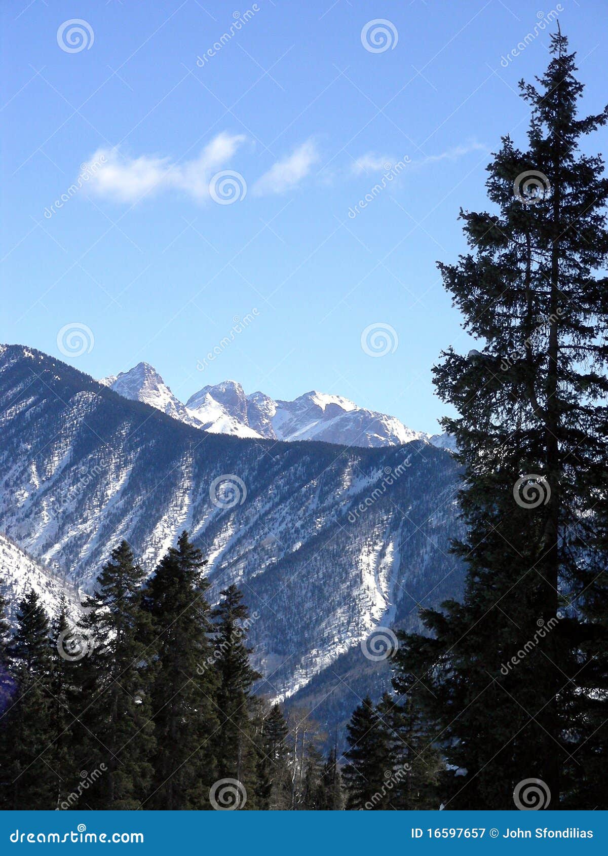 Sunlit Mountain stock image. Image of snow, pine, cloud - 16597657