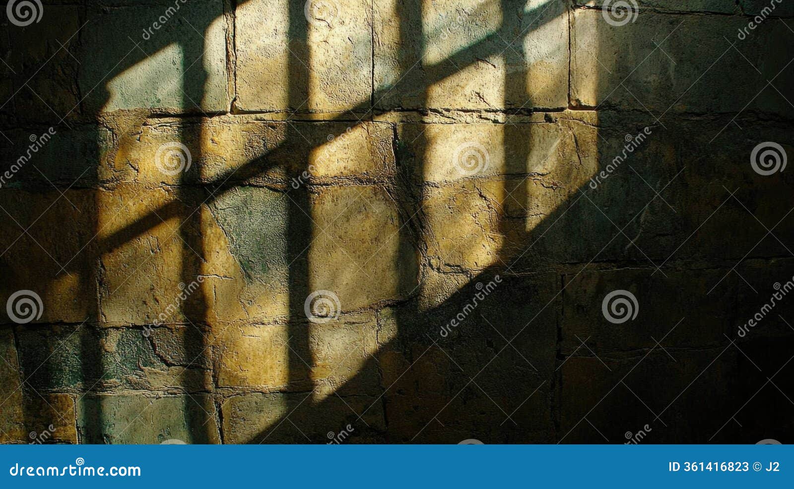 Sunlit Prison Cell Wall with Shadowy Bars Capturing Isolation and ...