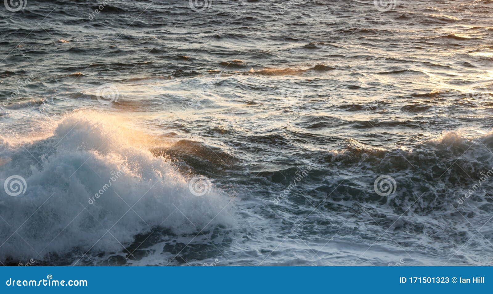 Sunlit Wave Evaporates stock image. Image of surf, britain - 171501323