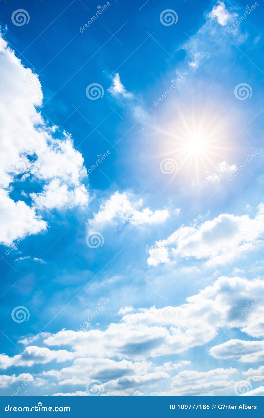 Blue Sky with Bright Sun and White Clouds Stock Photo - Image of ...