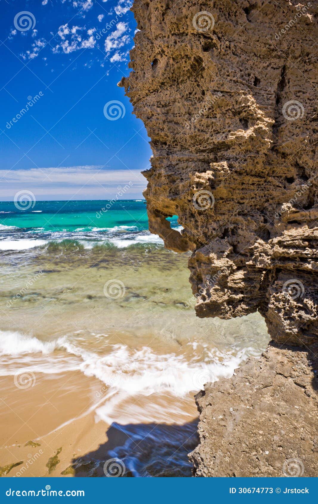 Sunny Beach with a Cliff in the Foreground Stock Image - Image of ...