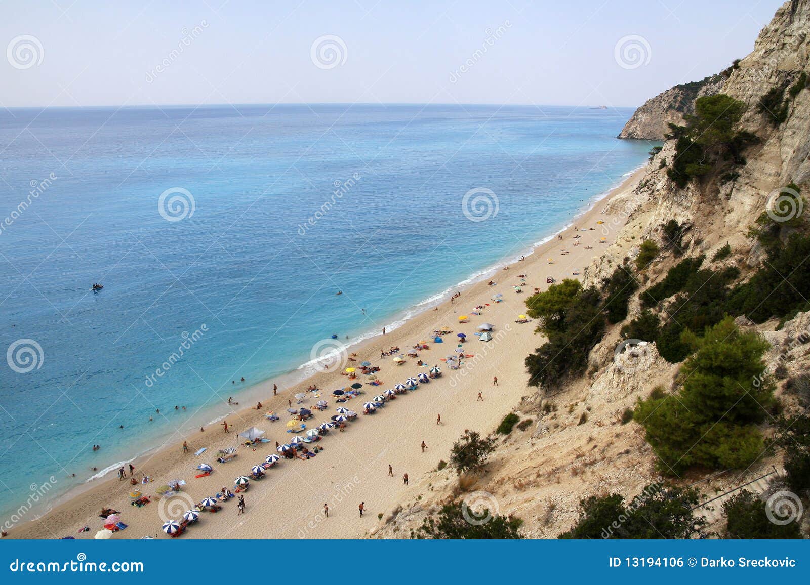 Sunny beach in Greece stock photo. Image of coast, sunbath - 13194106