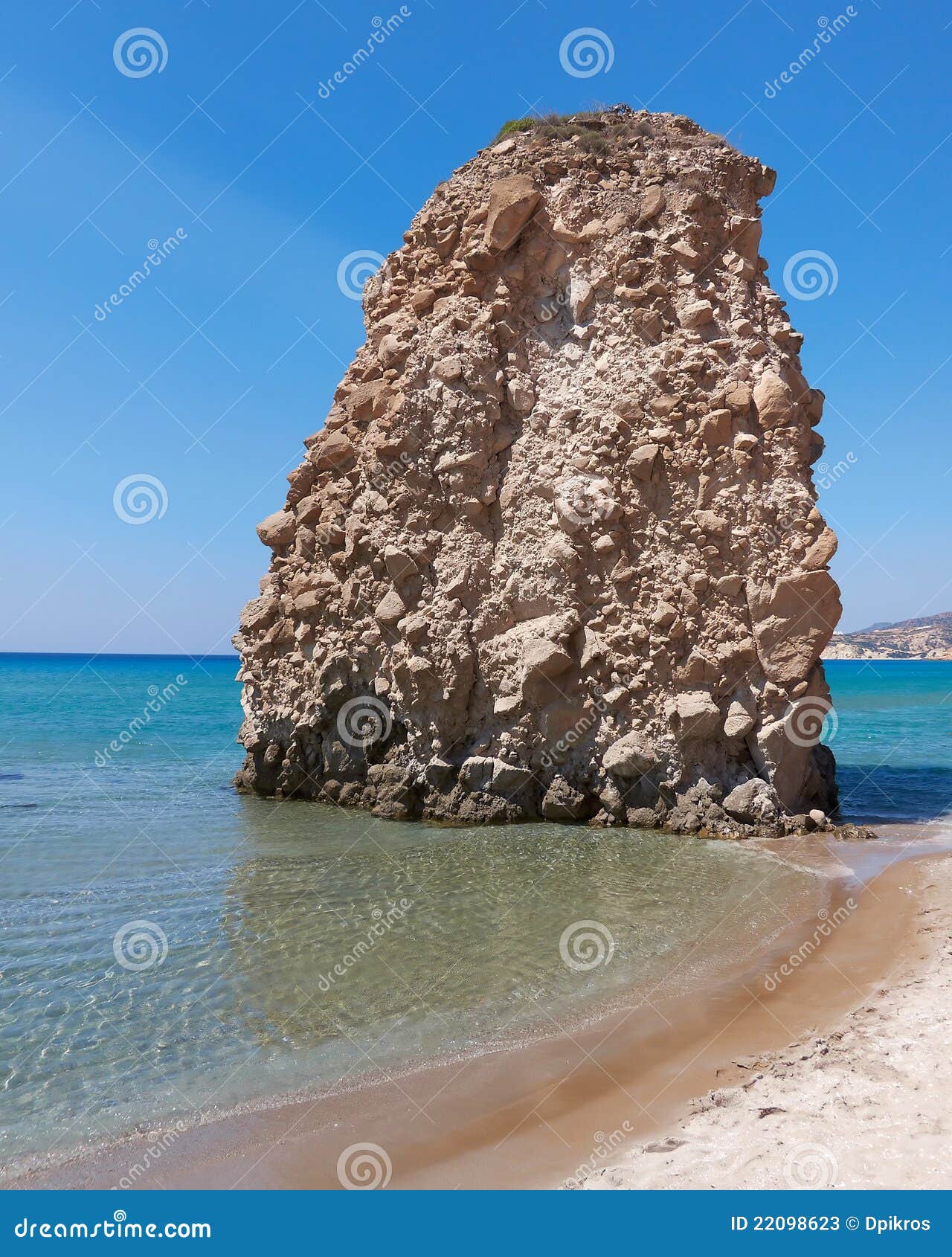 Sunny beach and huge rock stock image. Image of greece - 22098623