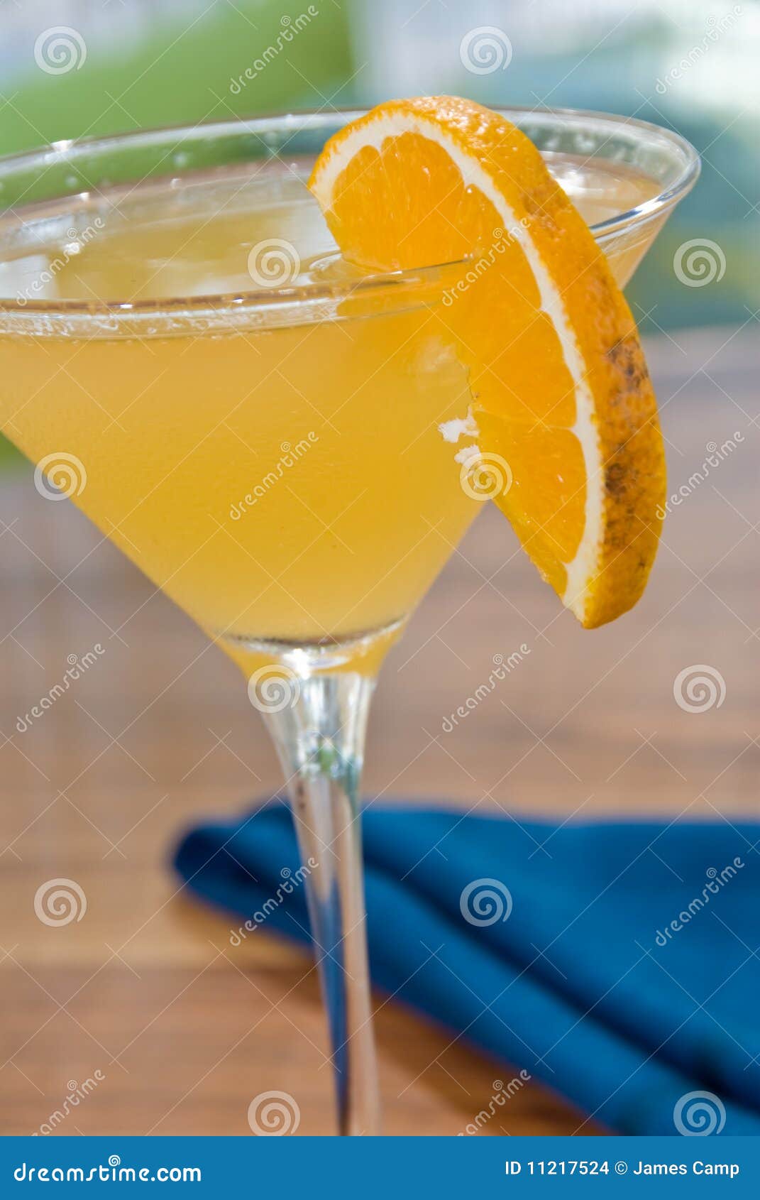 Sunny orange martini stock photo. Image of bright, table - 11217524