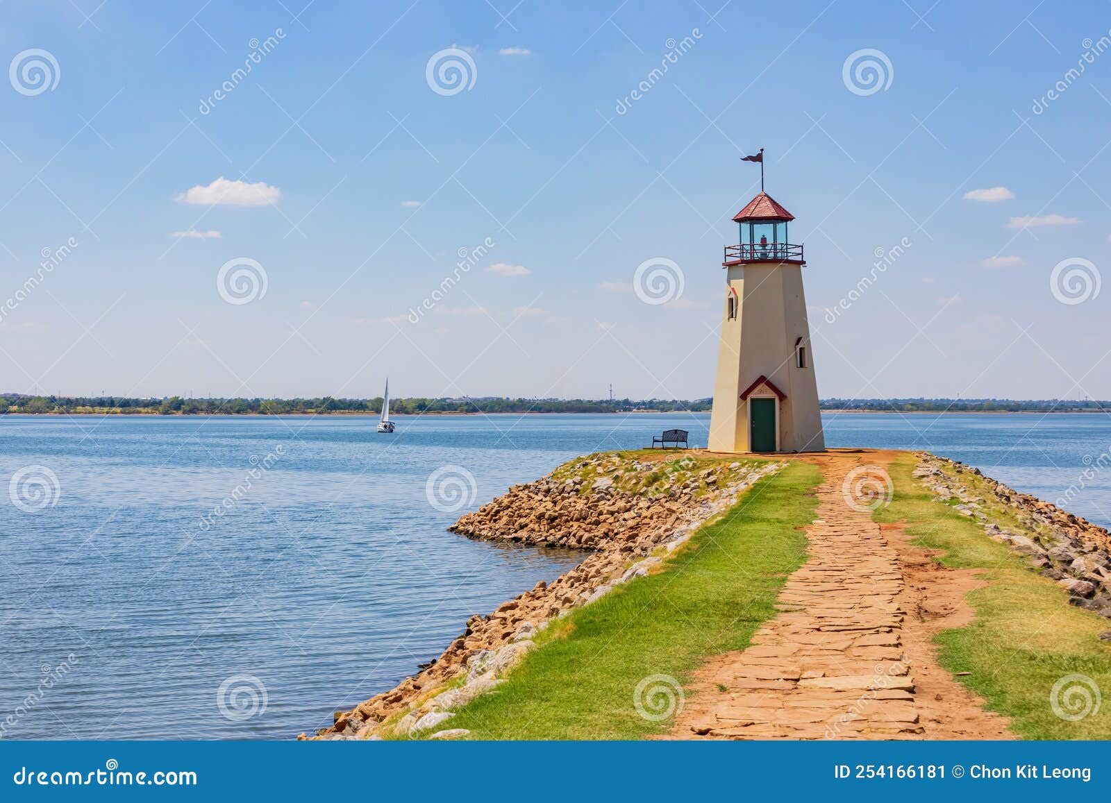 Sunny View of the Lake Hefner Lighthouse with a Sailing Boat Stock ...