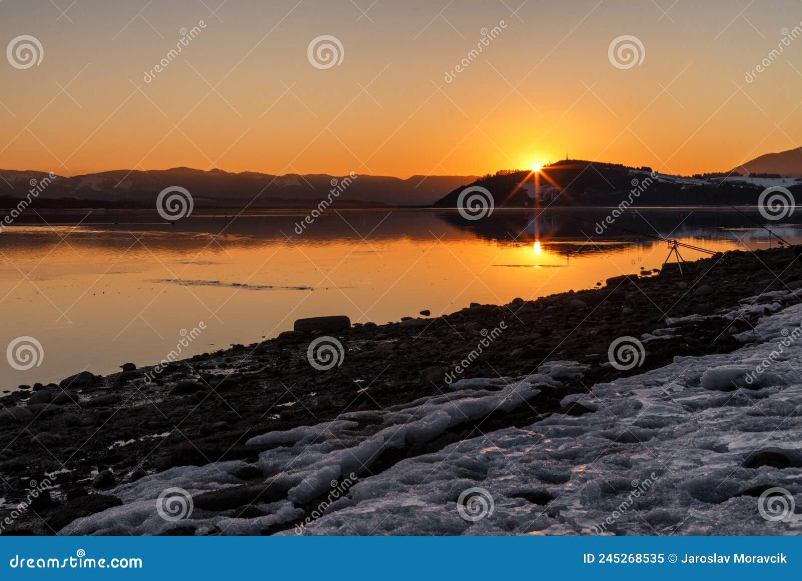 Sunrays on Evening Sky during Sunset with Snow on the Beach Editorial ...