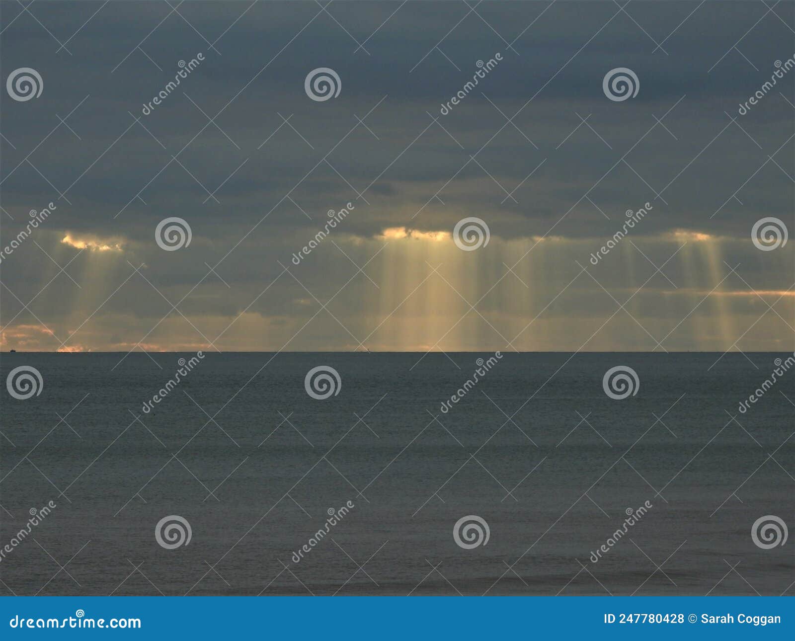 Sunrays through Heavy Clouds on the Beach Stock Photo - Image of cloud ...