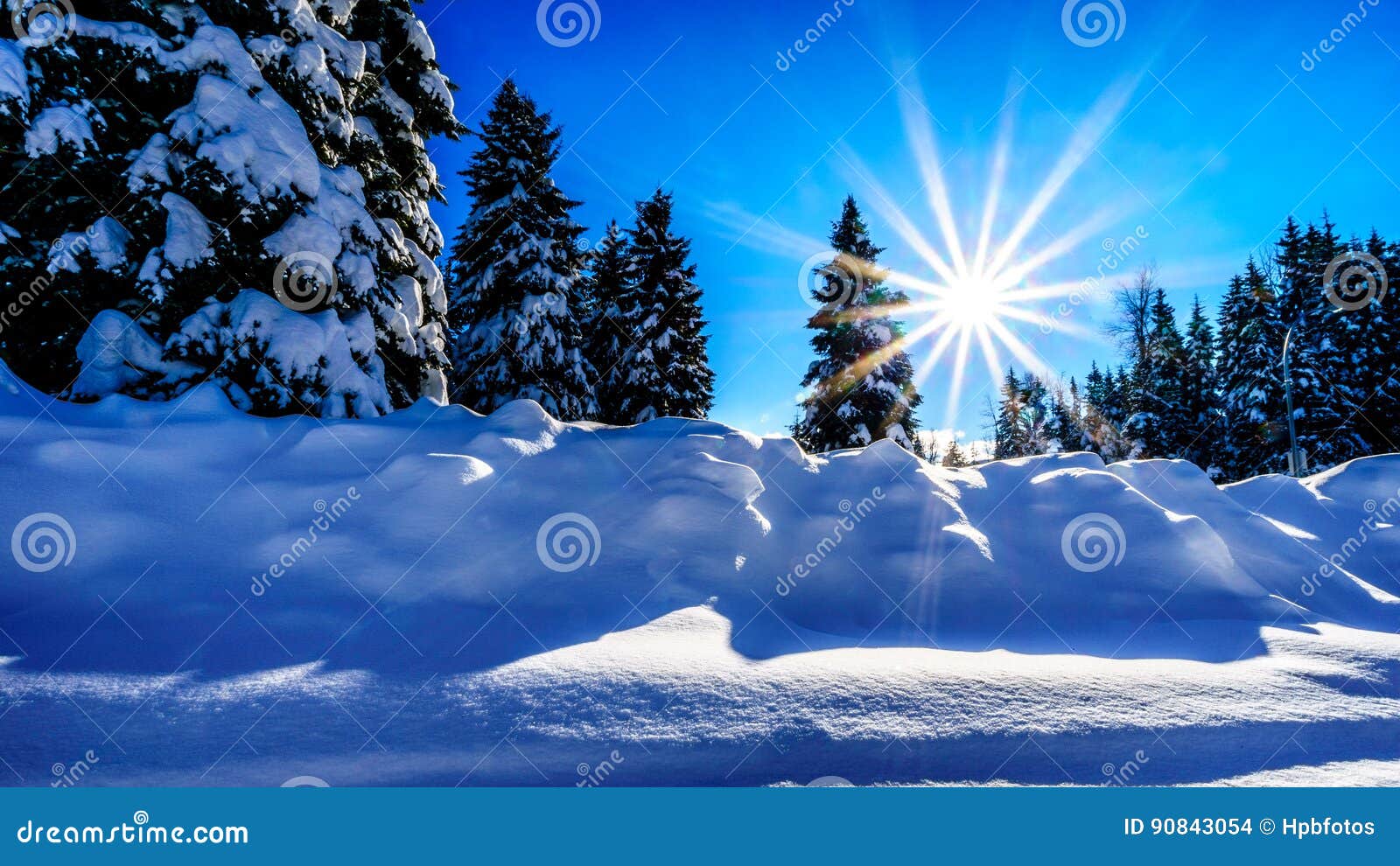 Sunrays from the Low Winter Sun Over a Deep Snow Pack Stock Photo ...