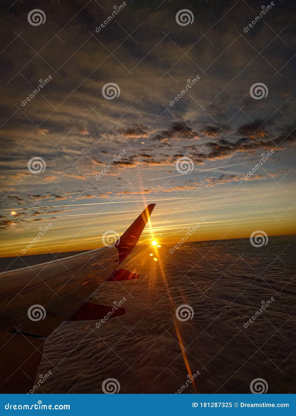 Sunrise from the Airplane Window Above the Clouds Stock Image - Image ...