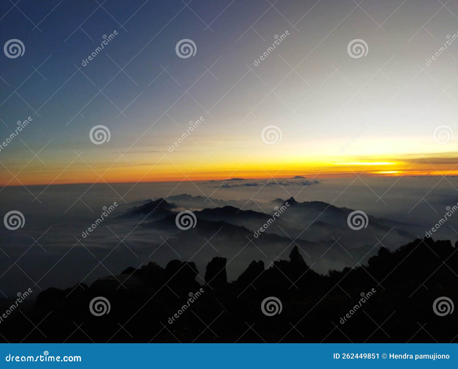 Sunset mt arjuna indonesia stock image. Image of dawn - 262449851