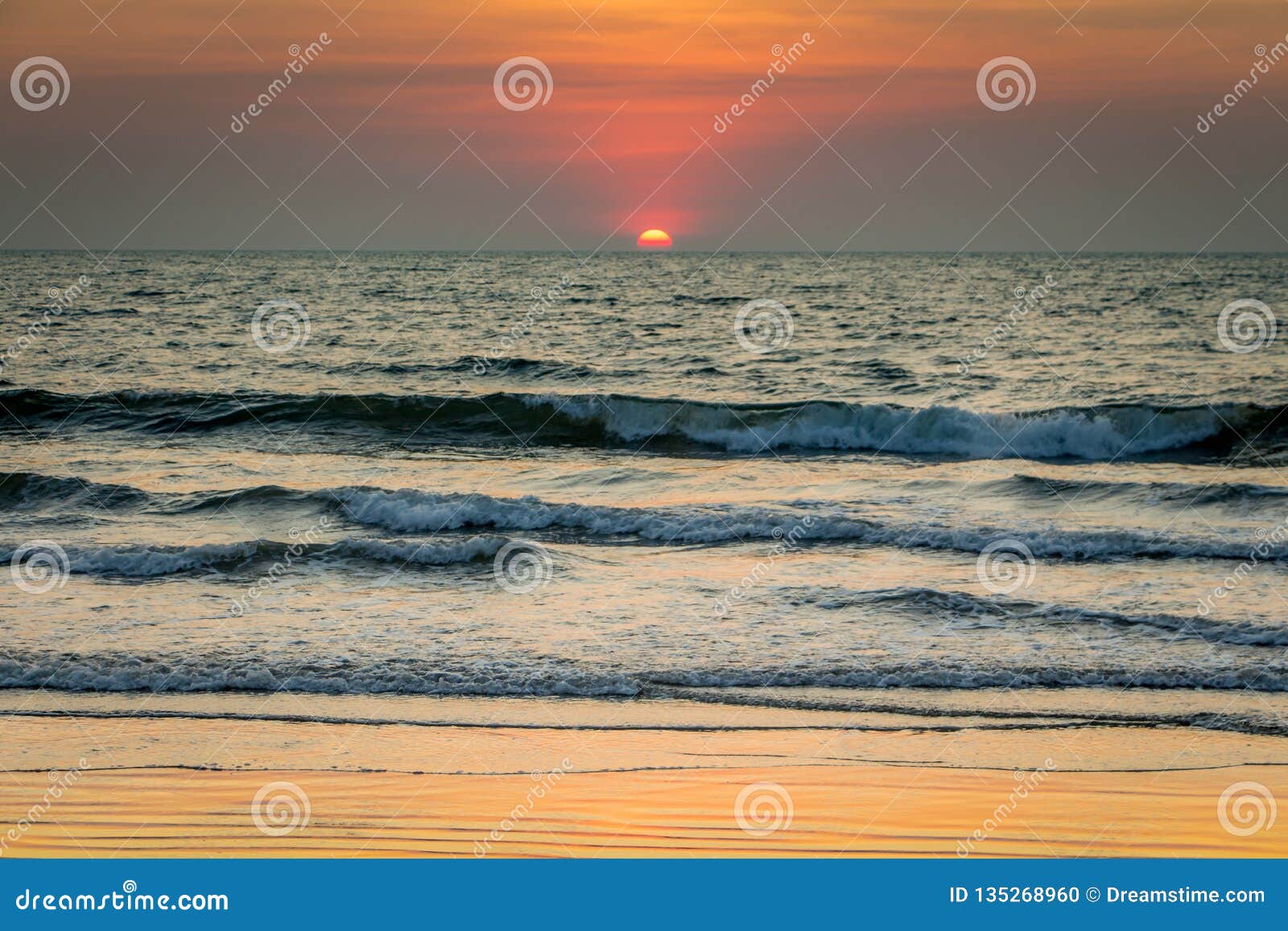 Sunrise on the beach stock photo. Image of coastline - 135268960