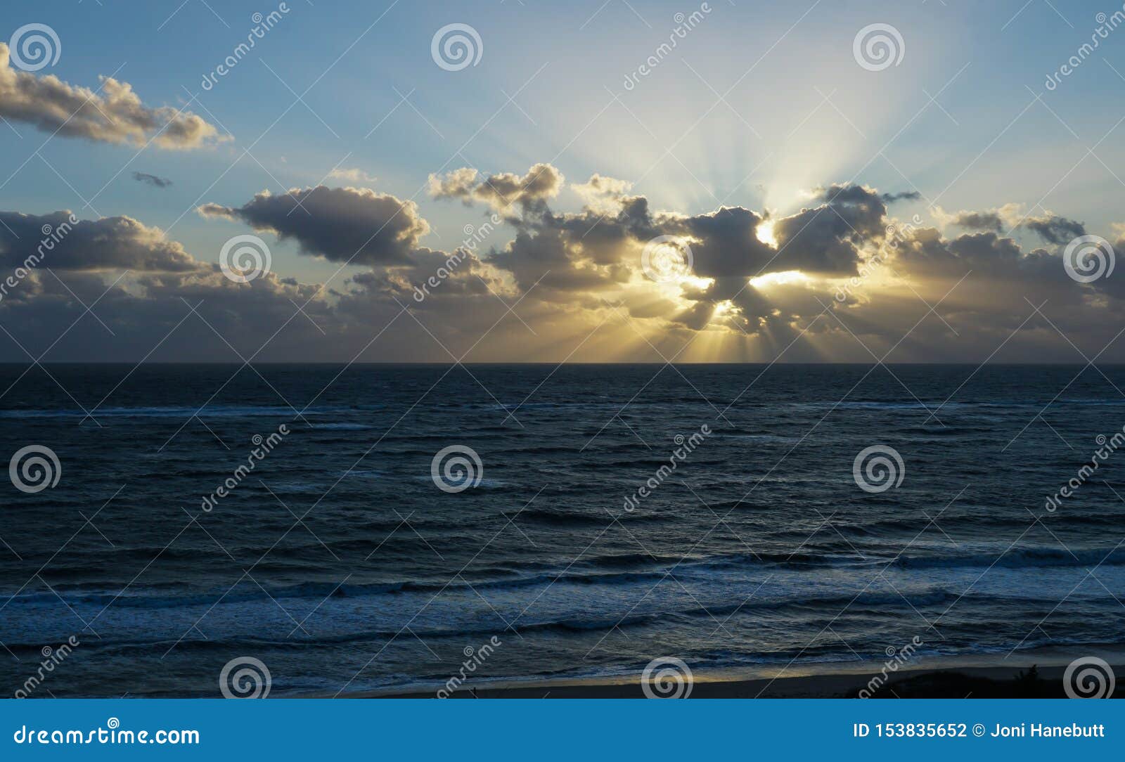 Sunrise on a Beach with Rays Stock Photo - Image of ocean, daylight ...
