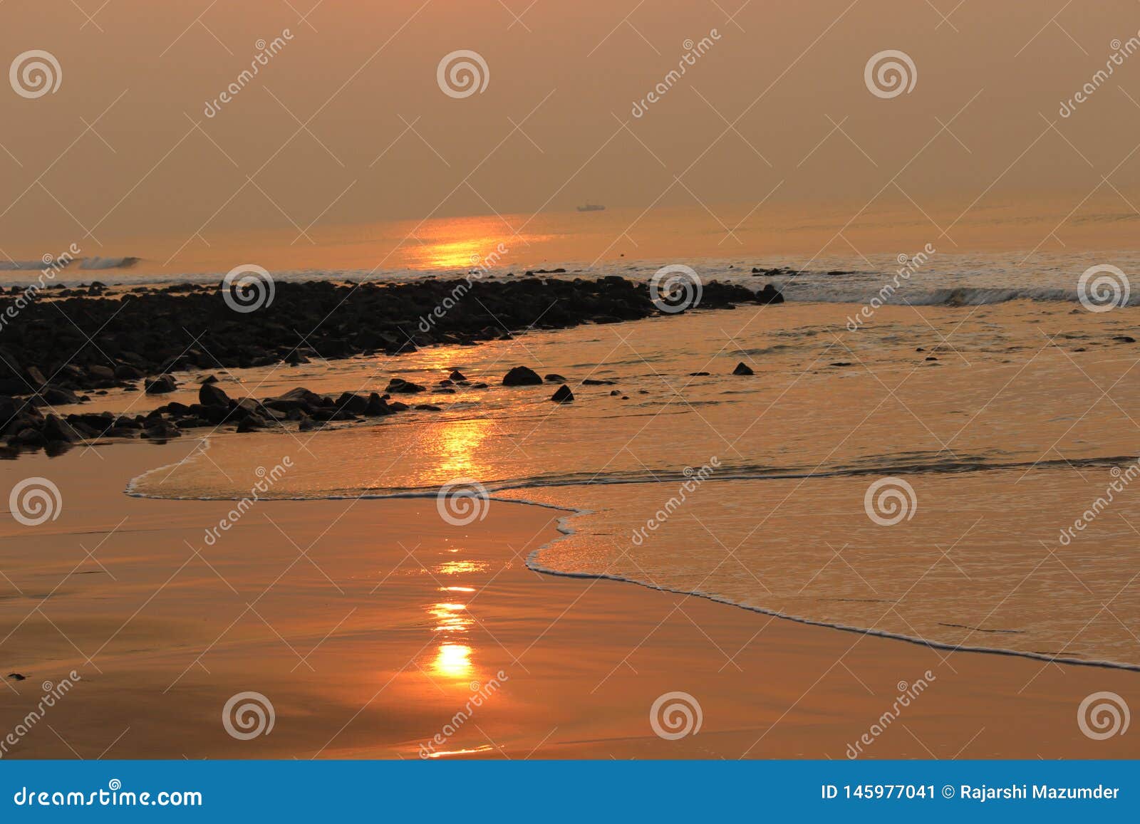 Sunrise on the beach stock image. Image of light, rays - 145977041