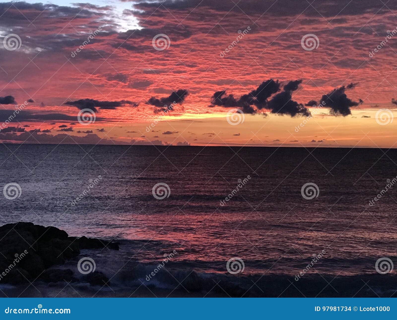 Sunrise at the beach stock photo. Image of sunrise, clouds - 97981734