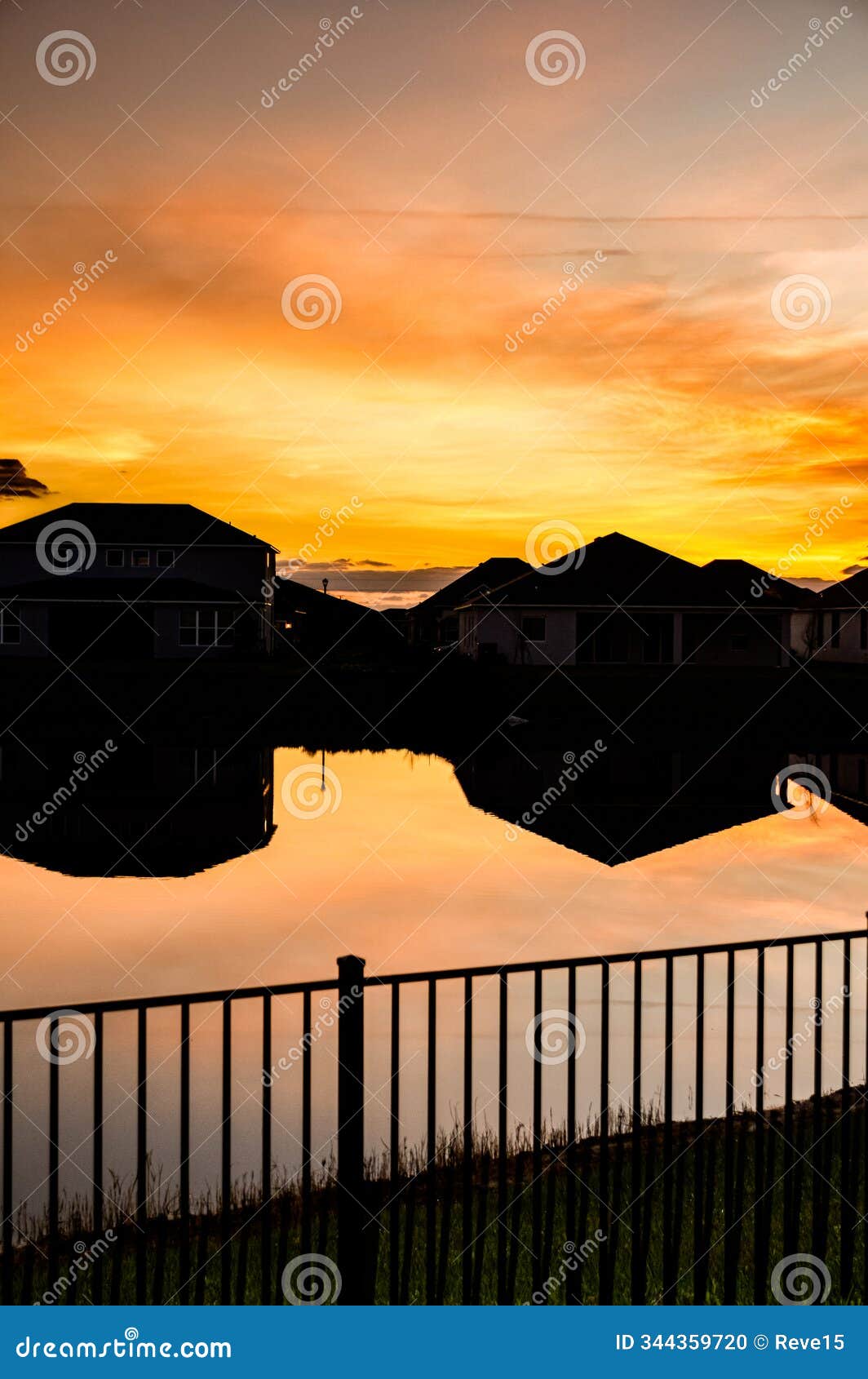 Sunrise Behind, a Group of Houses, on a Tropical Lake Front, with ...