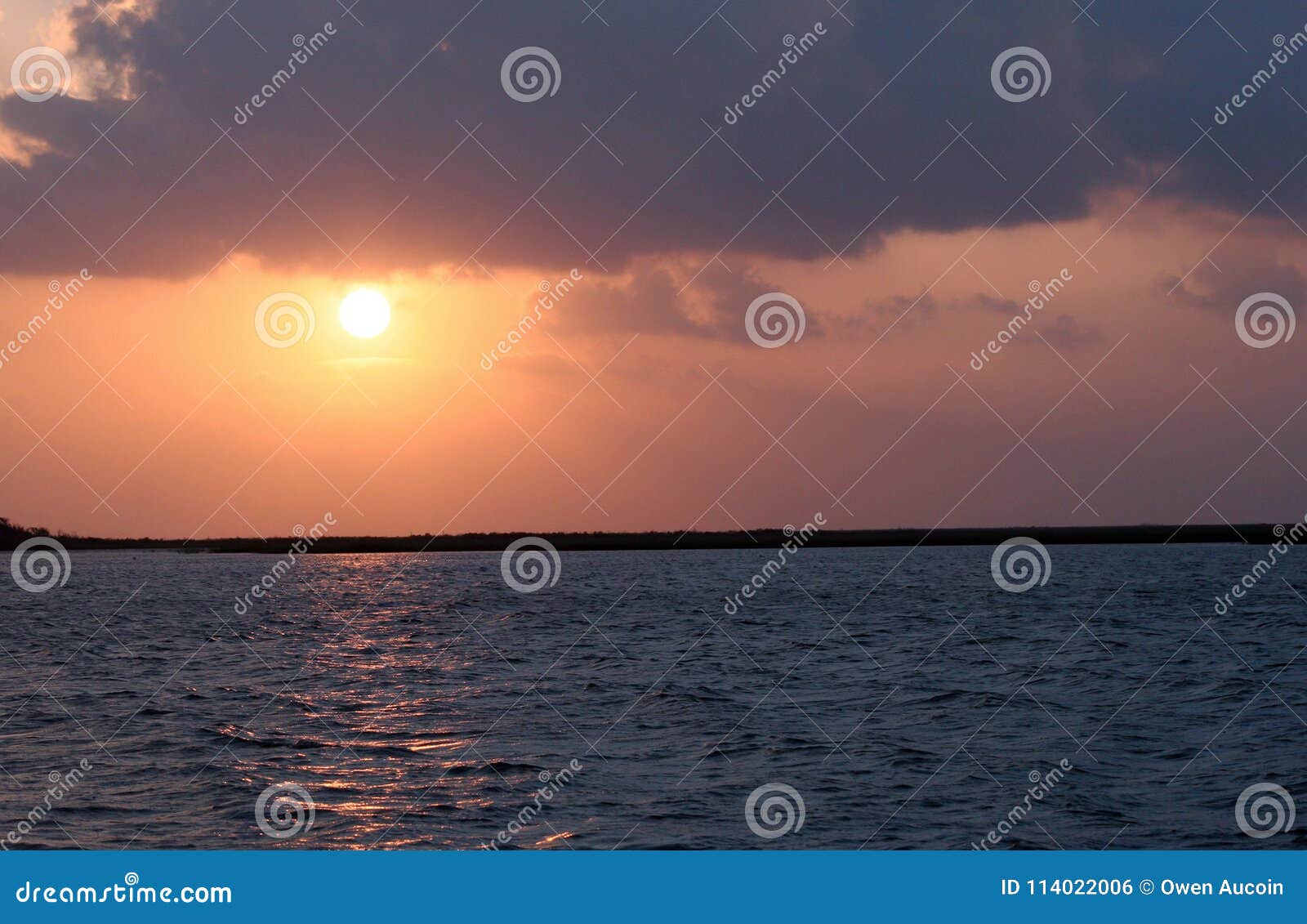 Sunrise with Dark Clouds and Sky with Multiple Colors Stock Photo ...