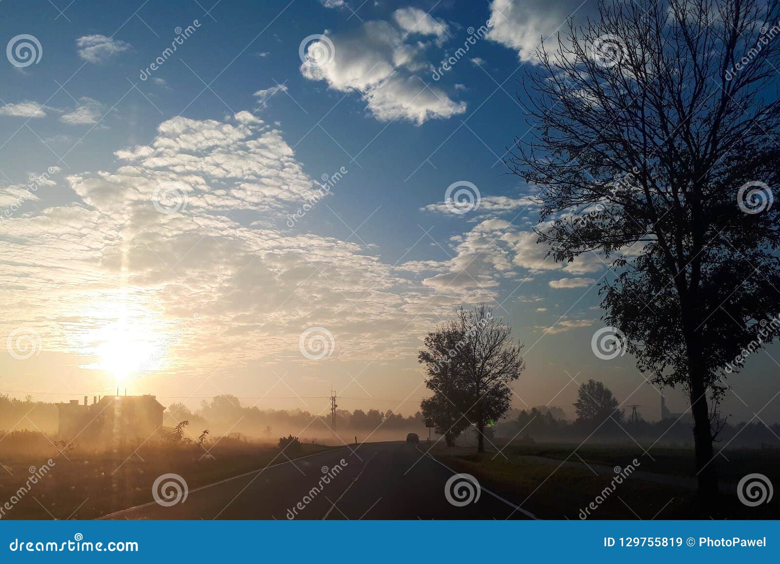 Sunrise on a Foggy Morning. the Sun Rises Above the Horizon and ... Sunrise on a Foggy Morning. the Sun Rises Above the Horizon and ...