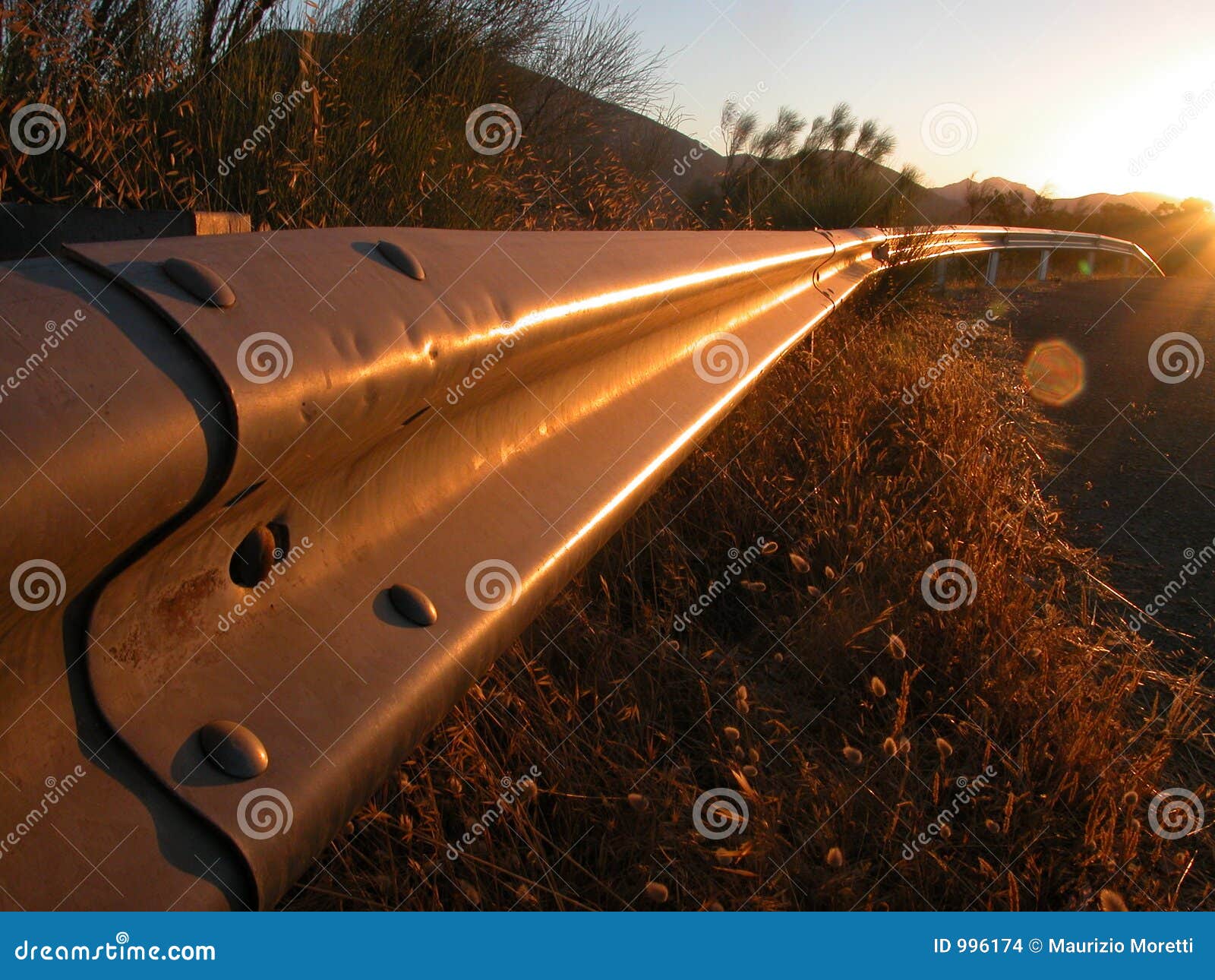 Sunrise on a guardrail stock photo. Image of landscape - 996174
