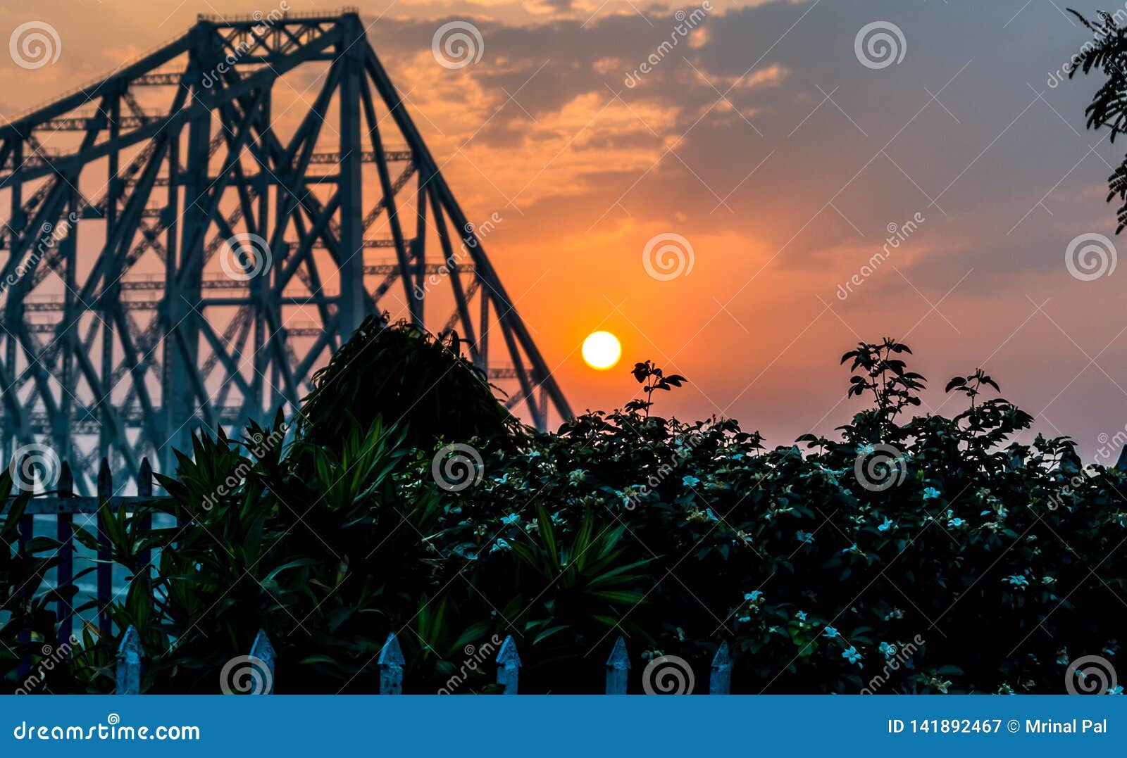 Sunrise and howrah bridge stock image. Image of grass - 141892467