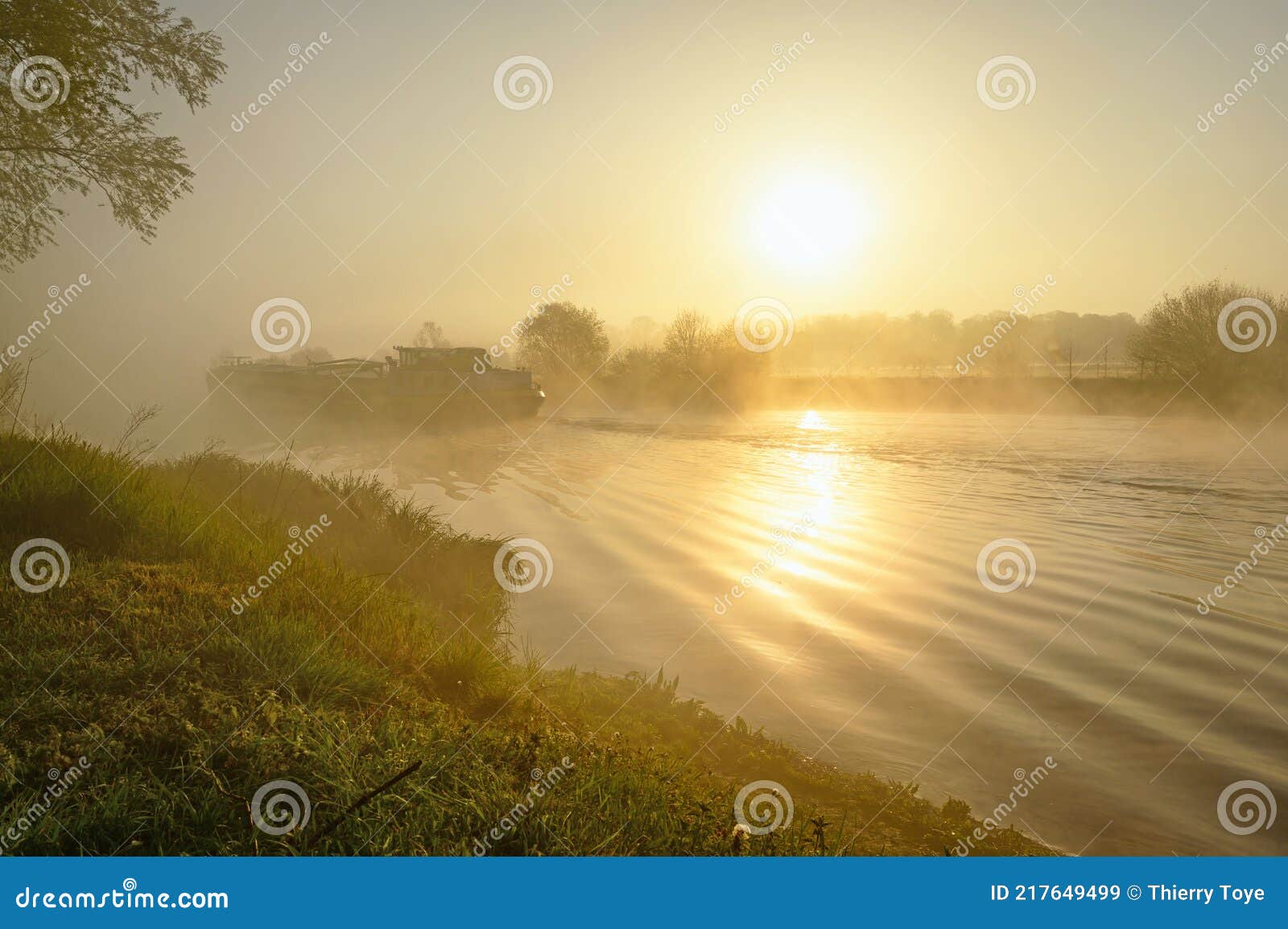 Sunrise on the Misty River with Boat Passing Stock Image - Image of ...