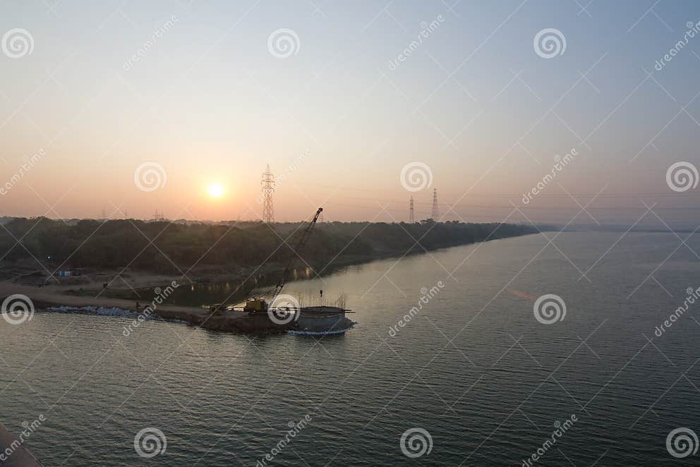 Sunrise near a river stock photo. Image of tower, water - 185516148