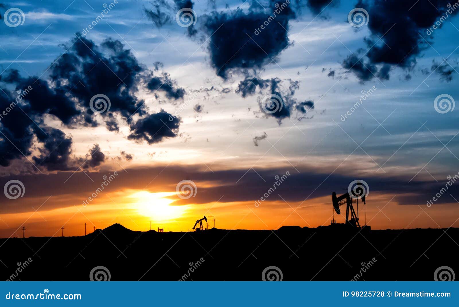 Sunrise oil fields stock photo. Image of sunrise, establishing - 98225728