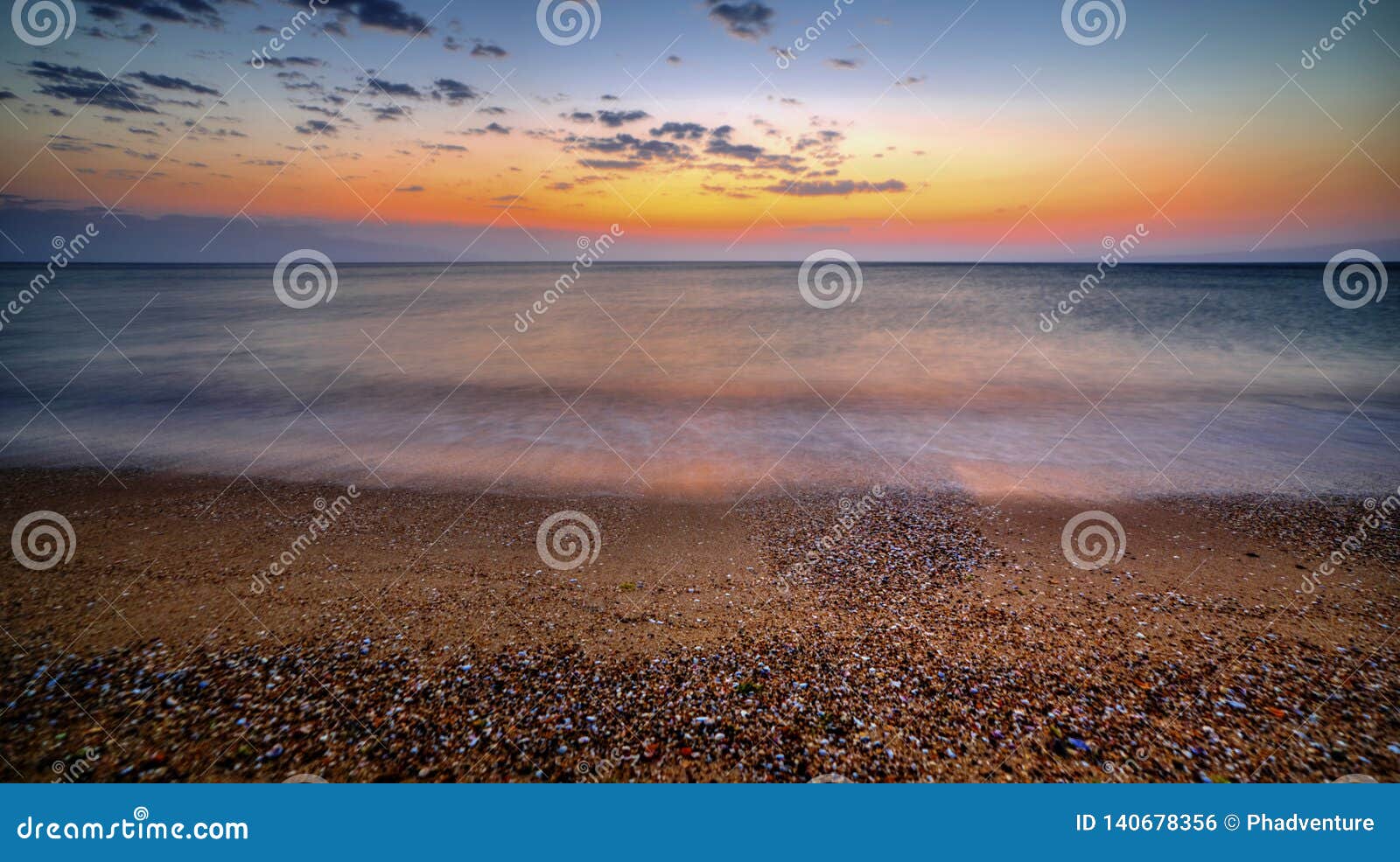 Sunrise over the beach stock photo. Image of light, cloudscape - 140678356