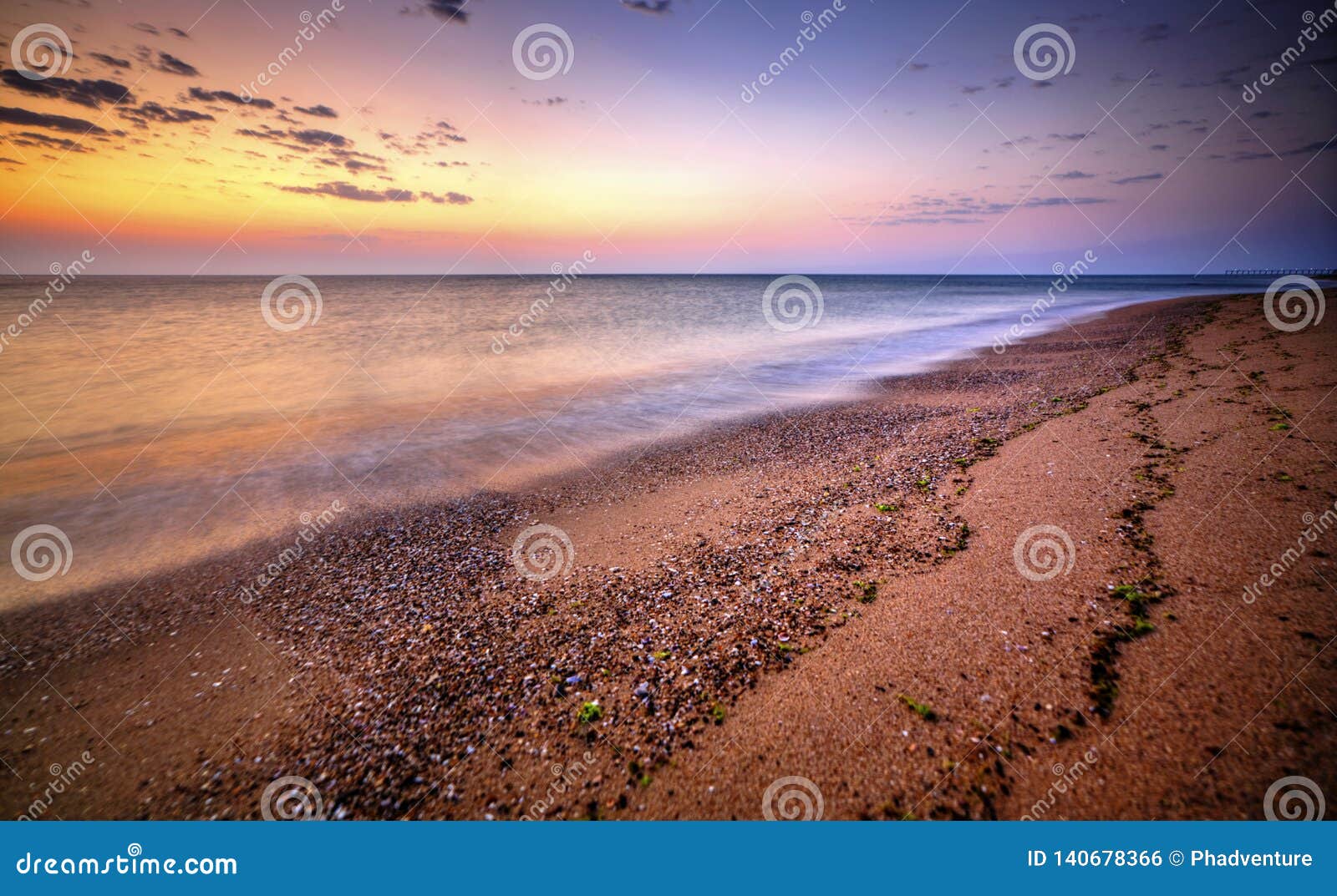 Sunrise over the beach stock photo. Image of sand, beauty - 140678366