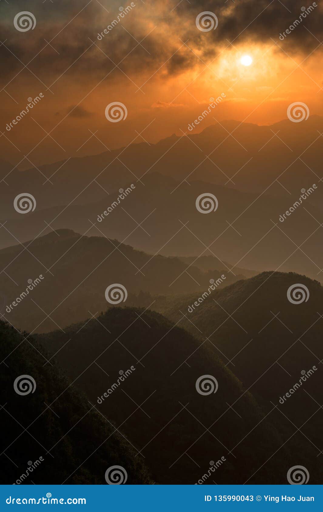 Sunrise over the hills stock image. Image of clouds - 135990043