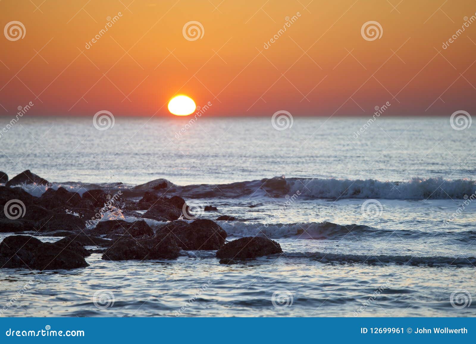 Sunrise over the ocean stock image. Image of reflection - 12699961