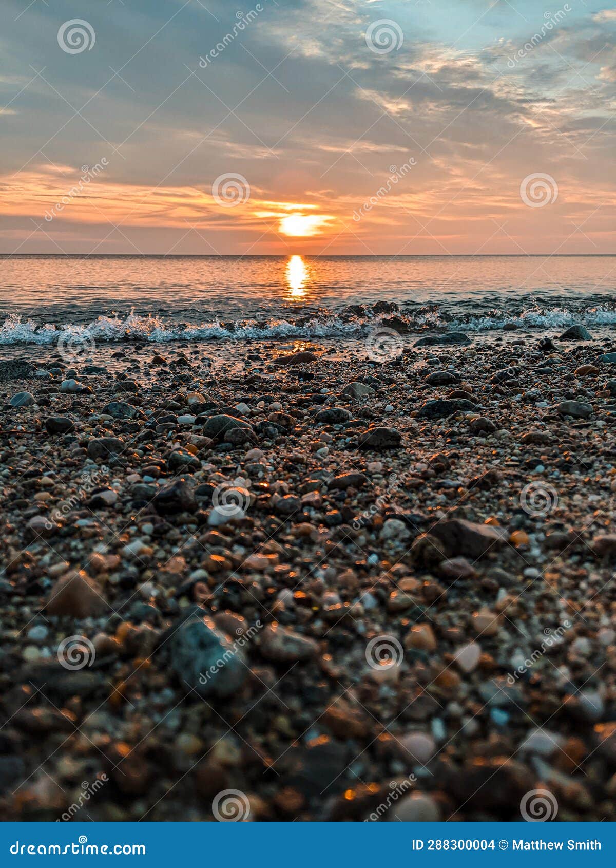 Sunrise Over the Pebbles of a Cape Cod Beach in Massachusetts. Stock ...