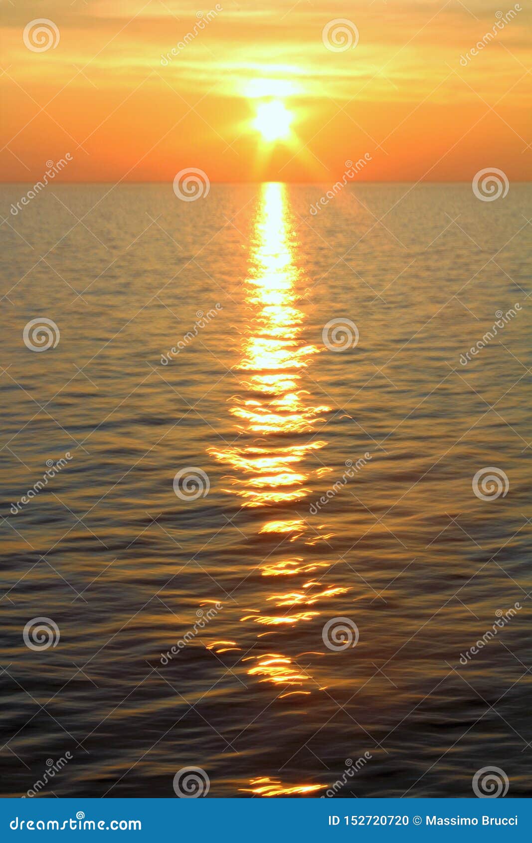 Sunrise Over the Sea with the Sun Rising Over the Horizon Stock Photo ...