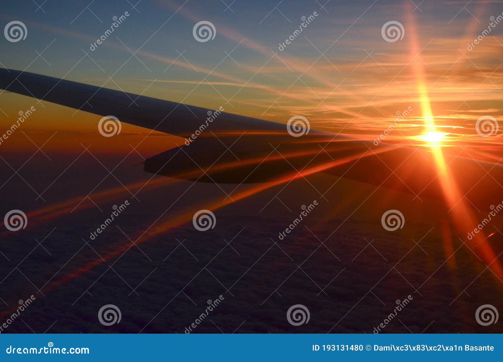 Sunrise from a plane stock photo. Image of cloud, flight - 193131480