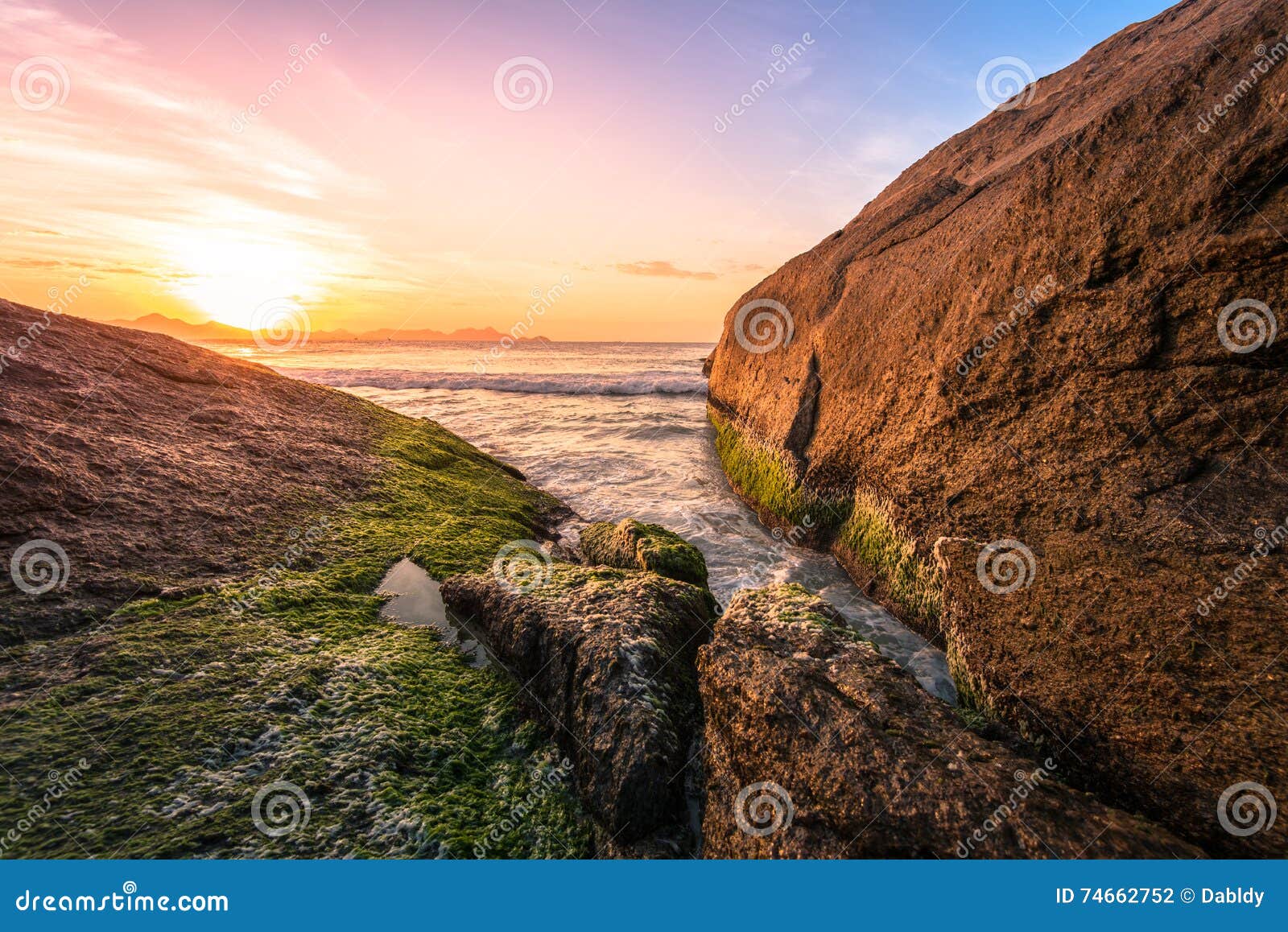 Sunrise between Rocks stock photo. Image of color, brown - 74662752