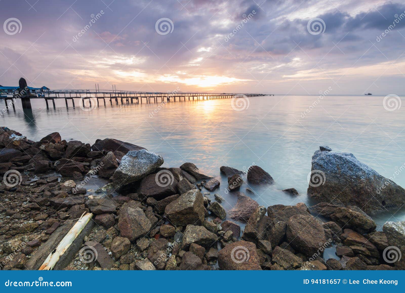 Sunrise by Shore with Rock Foreground for Background Stock Image ...