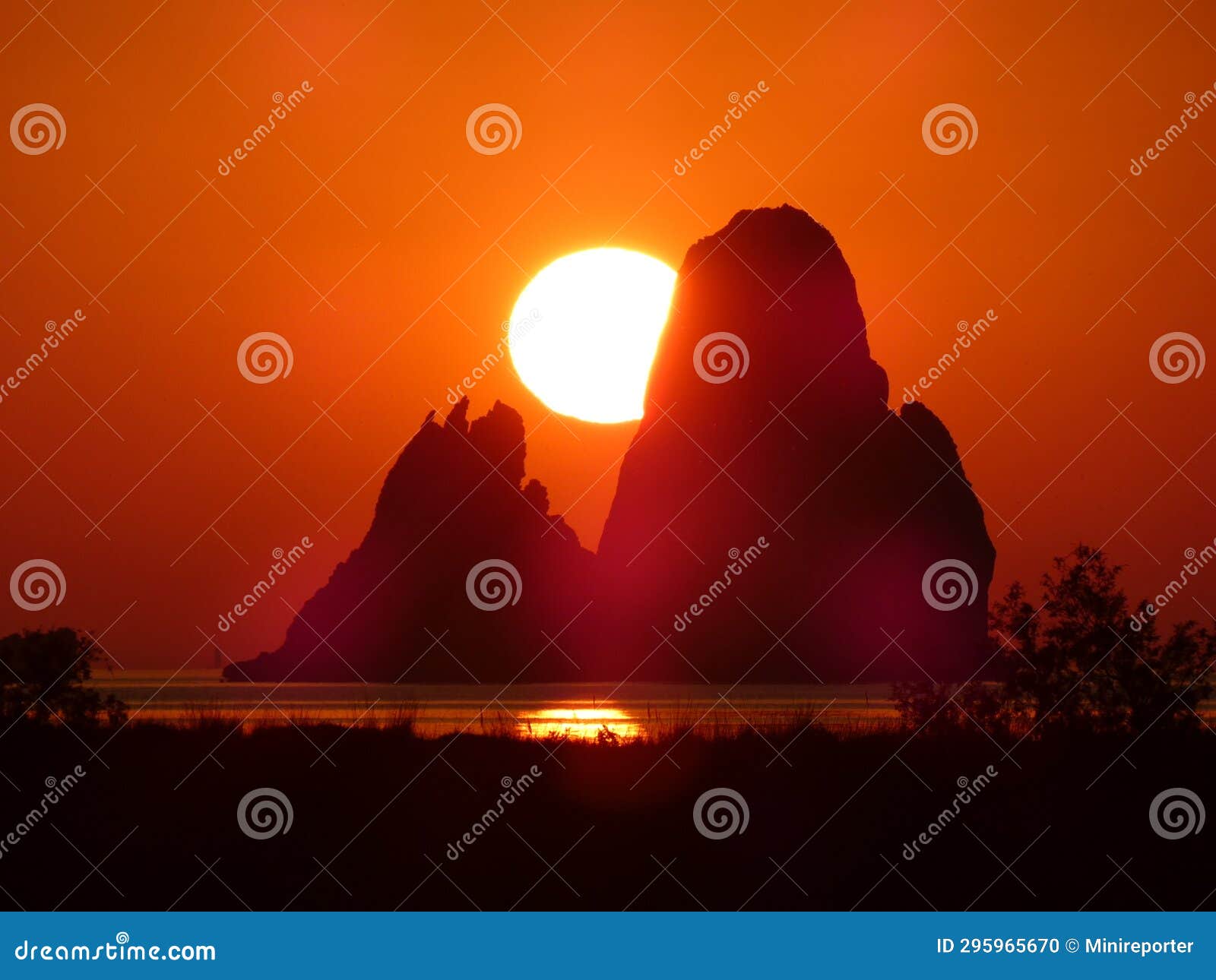 Sunrise between Small Medes Islands Stock Photo - Image of reflection ...
