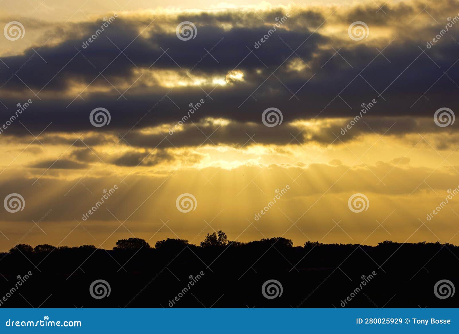 Sunrise with Sun through Clouds and God Rays Stock Image - Image of ...