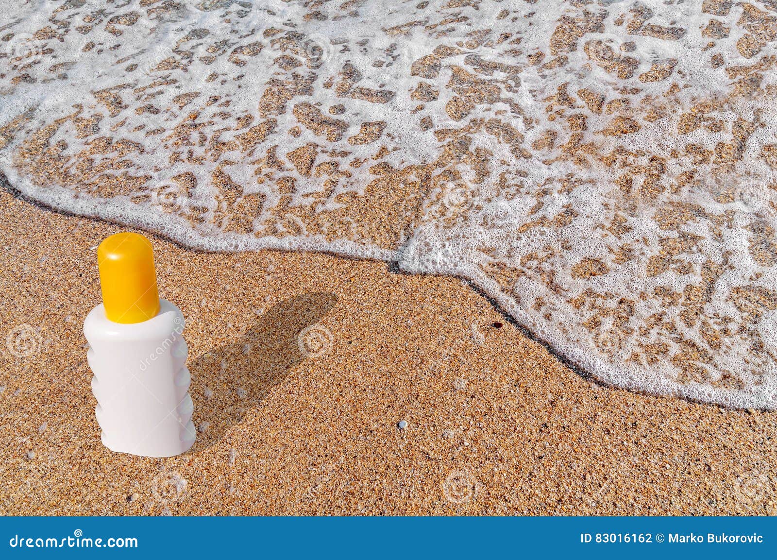 Sunscreen Cream Bottle on the Beach Stock Photo - Image of empty ...