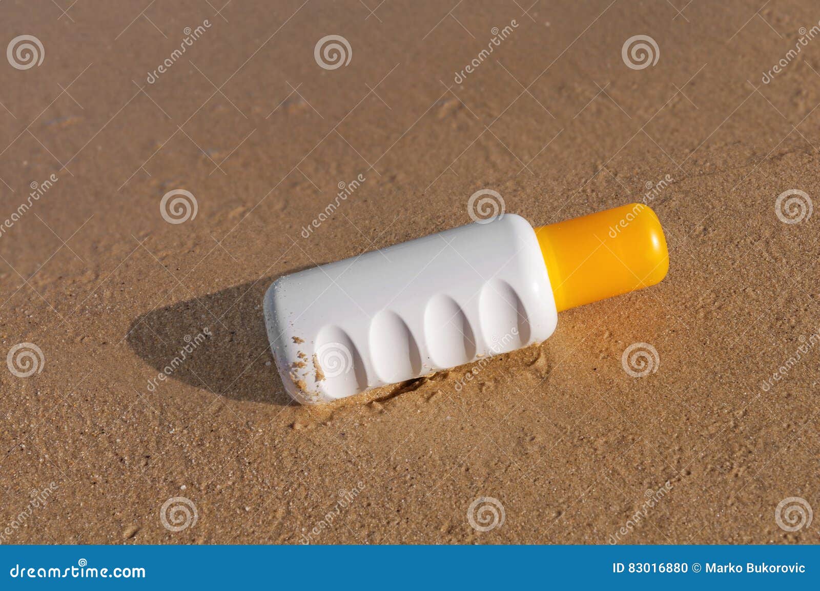 Sunscreen Cream Bottle on the Beach Stock Photo - Image of summer ...