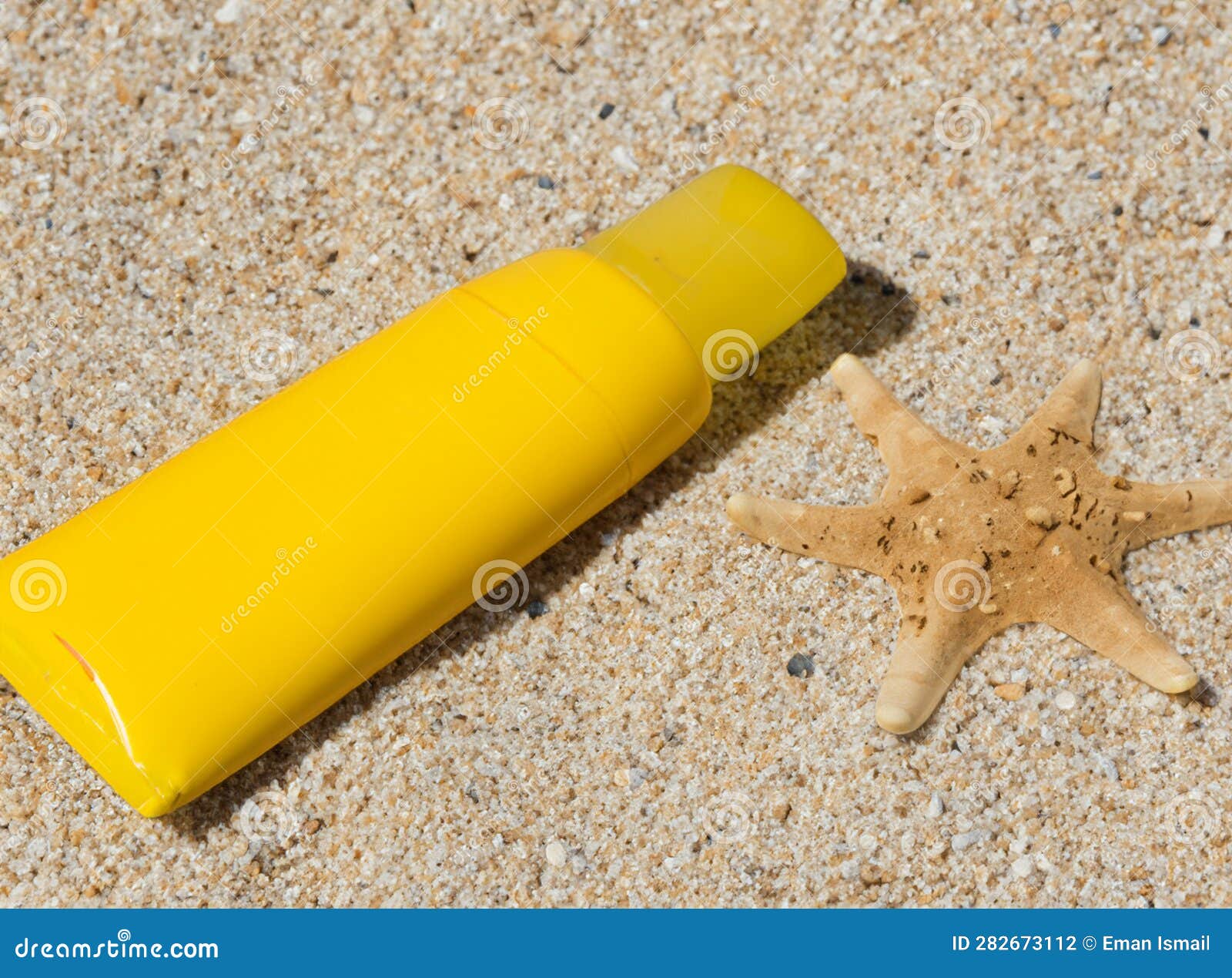 Sunscreen Tube on Beach Sand Stock Photo - Image of green, orange ...