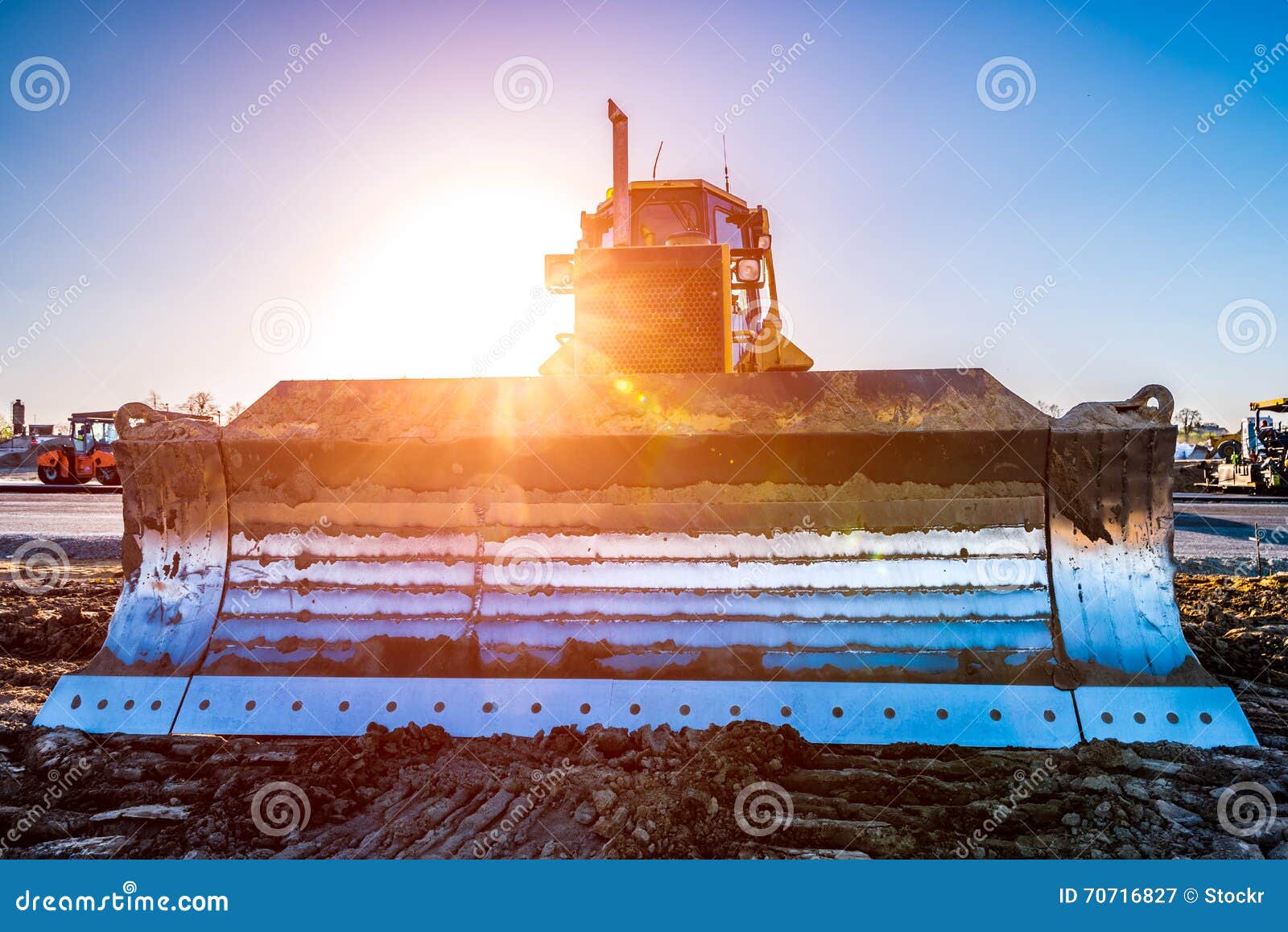 Sunset Above the Bulldozer Working on the Construction Site Stock Image ...