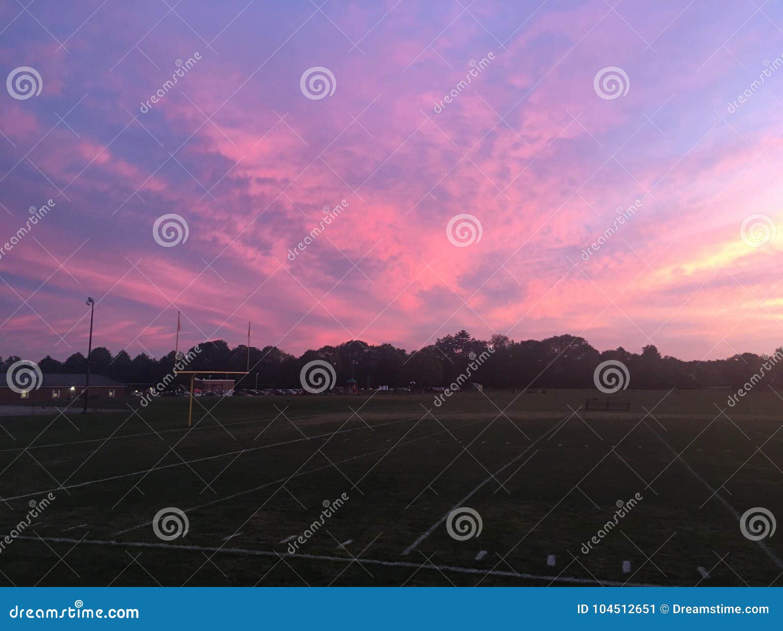 Sunset across the field stock image. Image of dawn, plain - 104512651