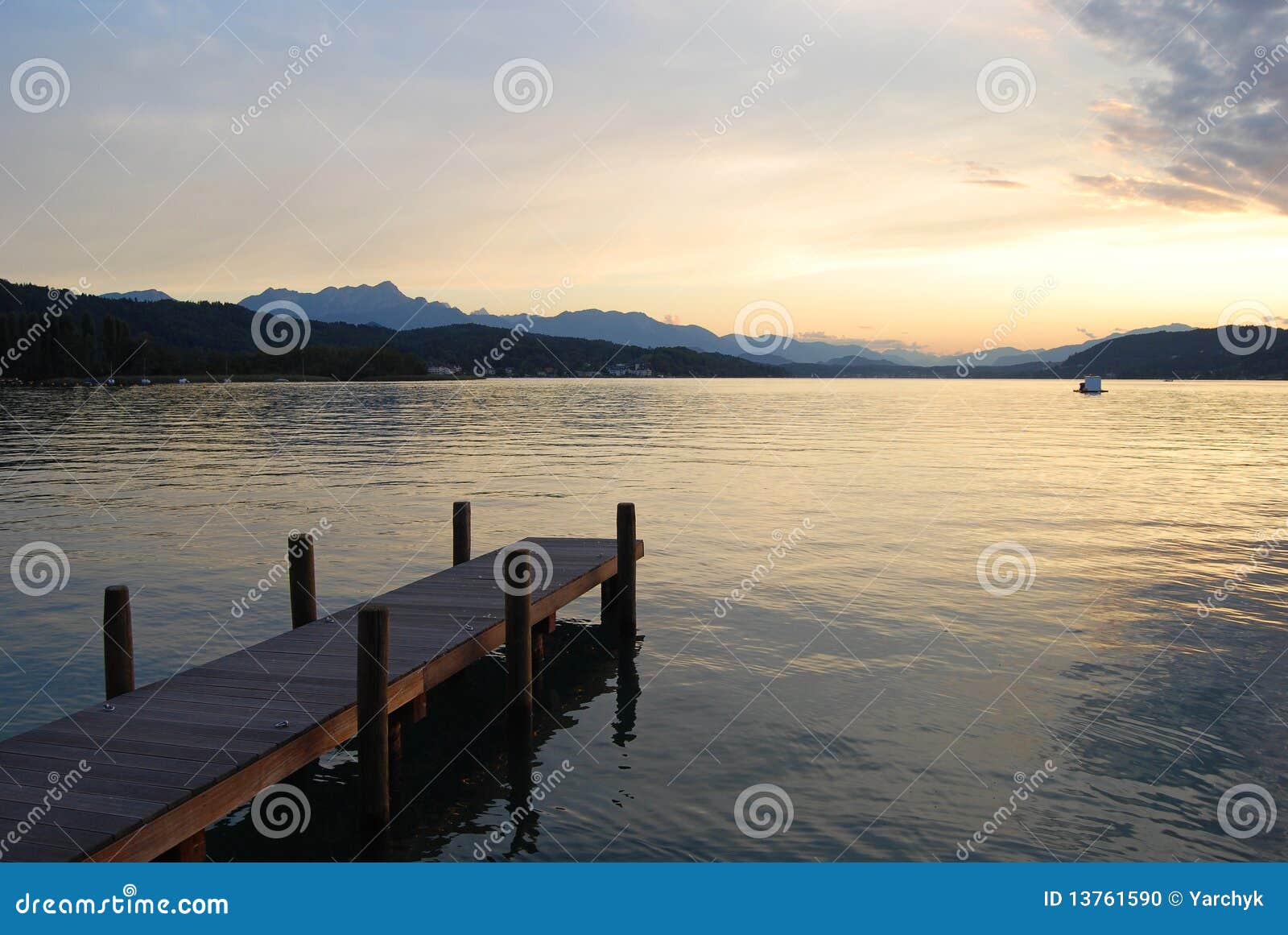 Sunset on an alpine lake stock photo. Image of boat, mountain - 13761590