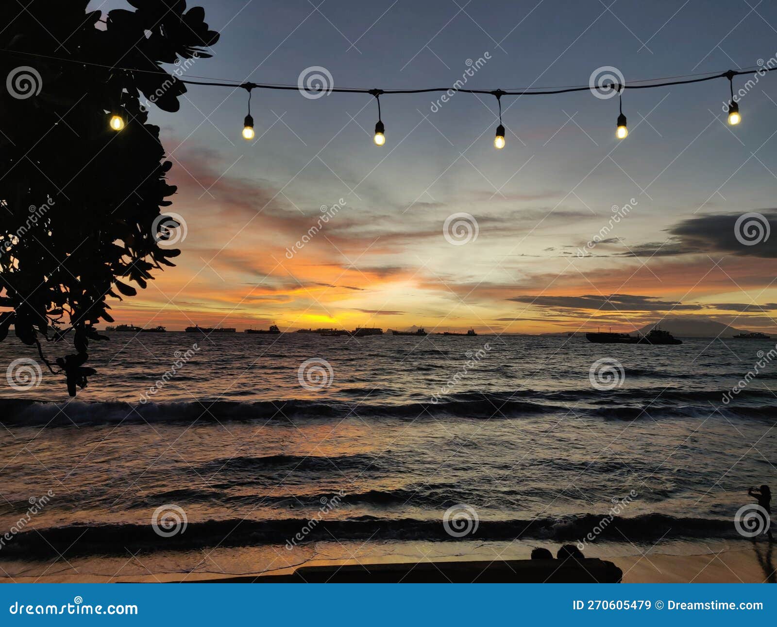 Sunset on the Beach with Light Bulbs Stock Image - Image of sundown ...