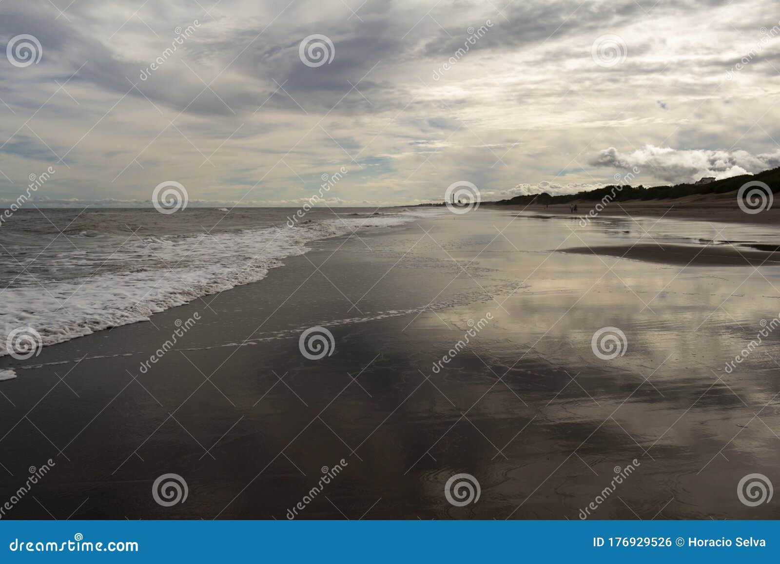Sunset at the Beach. Reflections of the Sun in the Wet Sand. Storm ...
