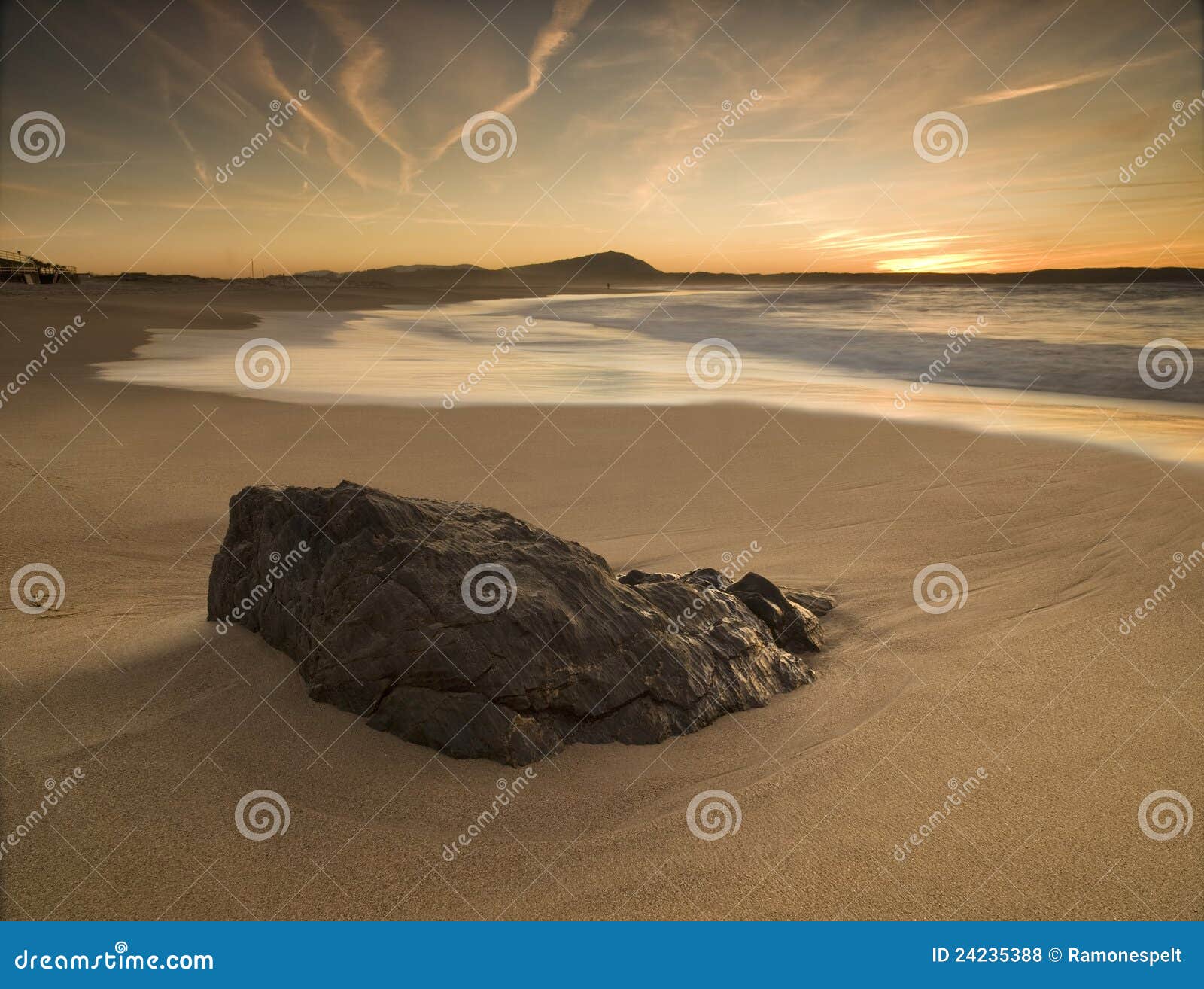 Sunset on the Beach with Rock in the Foreground Stock Photo - Image of ...